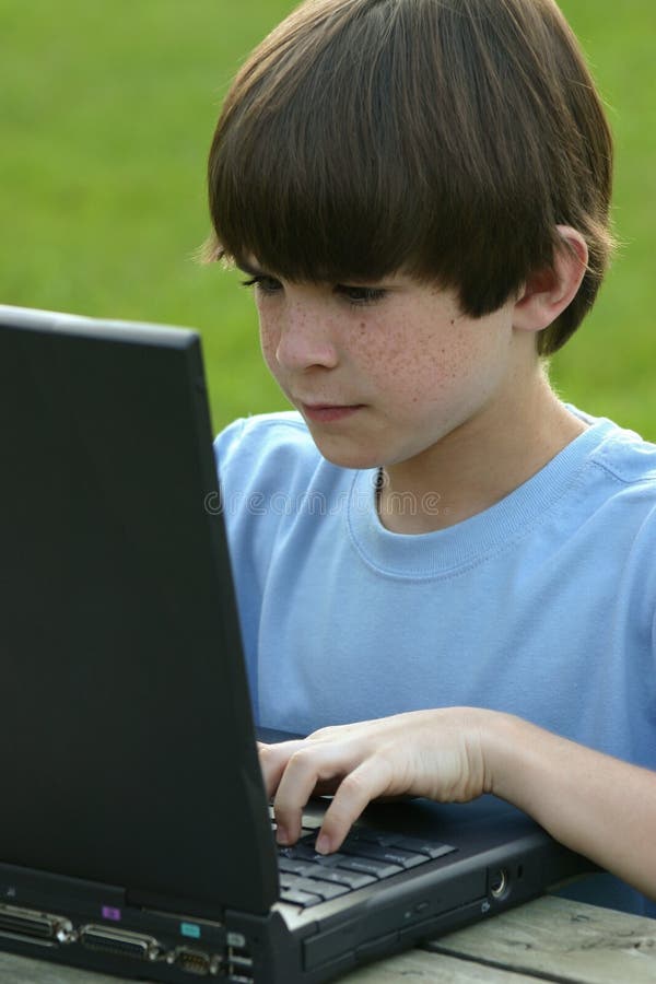 Boy Using Laptop stock photo. Image of learning, handsome - 1211376