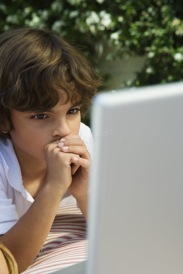 Boy Using Laptop stock image. Image of relaxation, concentrating - 29662475