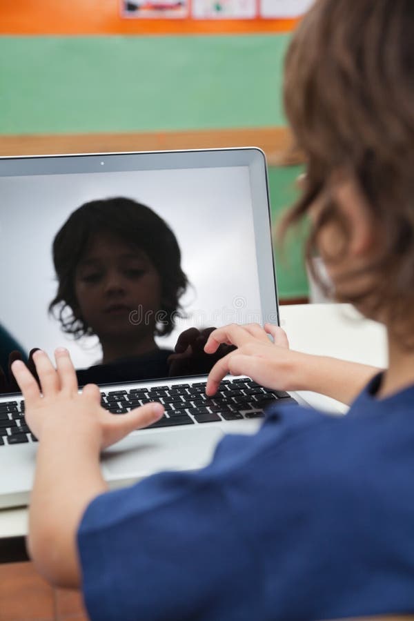 Boy Using Laptop in Classroom Stock Photo - Image of playschool ...