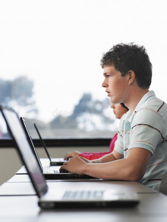 Boy Using Laptop in Computer Class Stock Photo - Image of laptop, girl ...