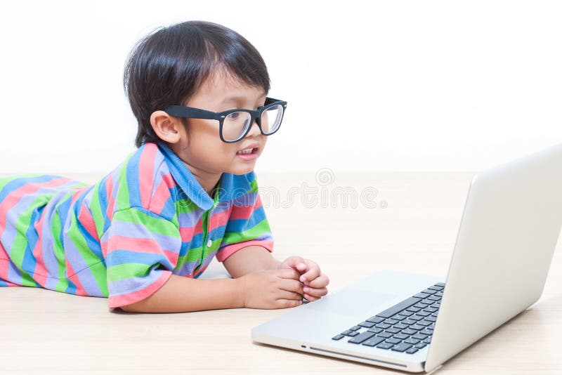 Boy using laptop computer stock photo. Image of cute - 45144684
