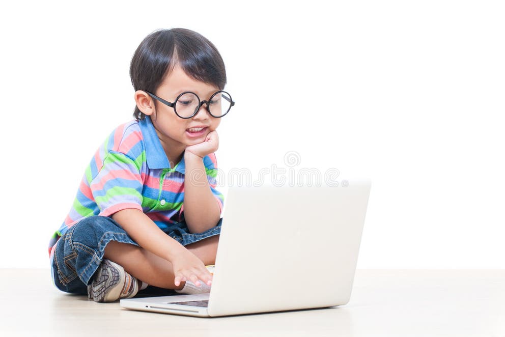 Boy using laptop computer stock image. Image of children - 45144727