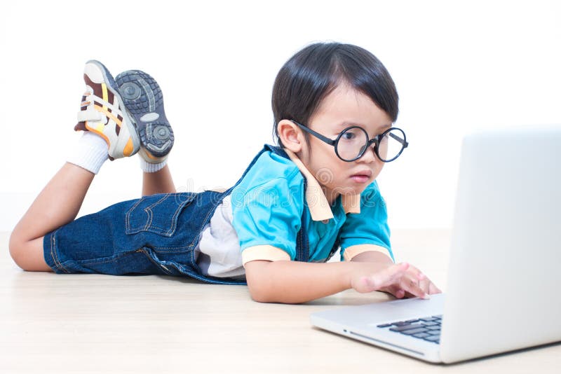 Boy using laptop computer stock image. Image of communication - 45144639