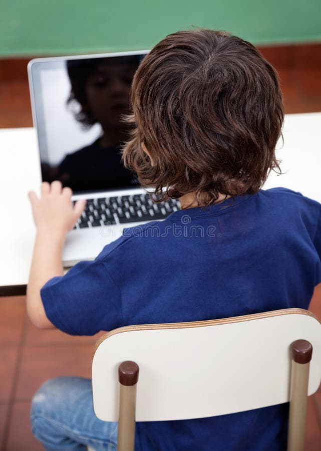 Boy Using Laptop in Kindergarten Stock Image - Image of indoor ...