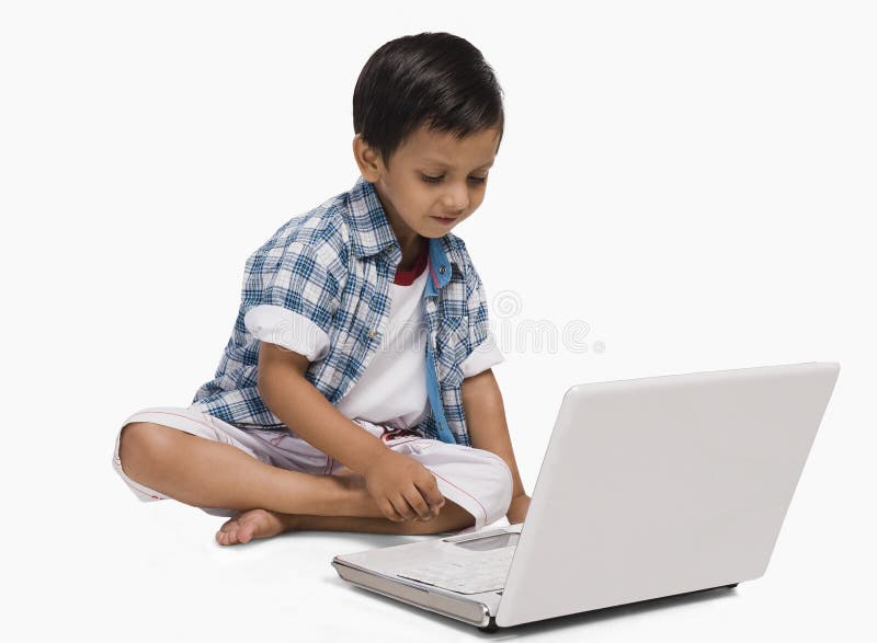Boy using a laptop stock image. Image of horizontal, looking - 36256537