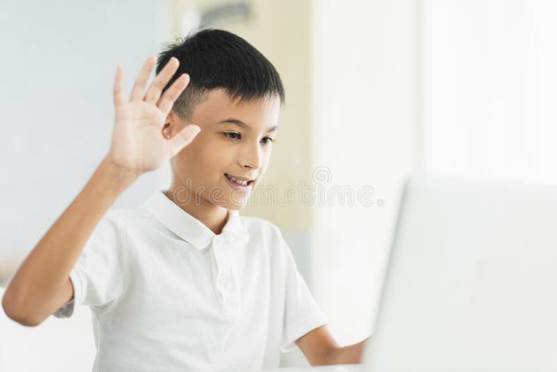 Boy Using Laptop To Study and Saying Hi To Teacher and Classmate Stock ...