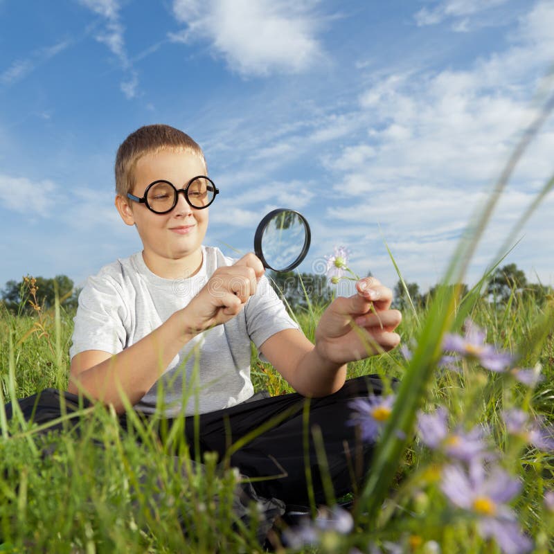 Boy using Magnifying Glass stock image. Image of environment - 20875705