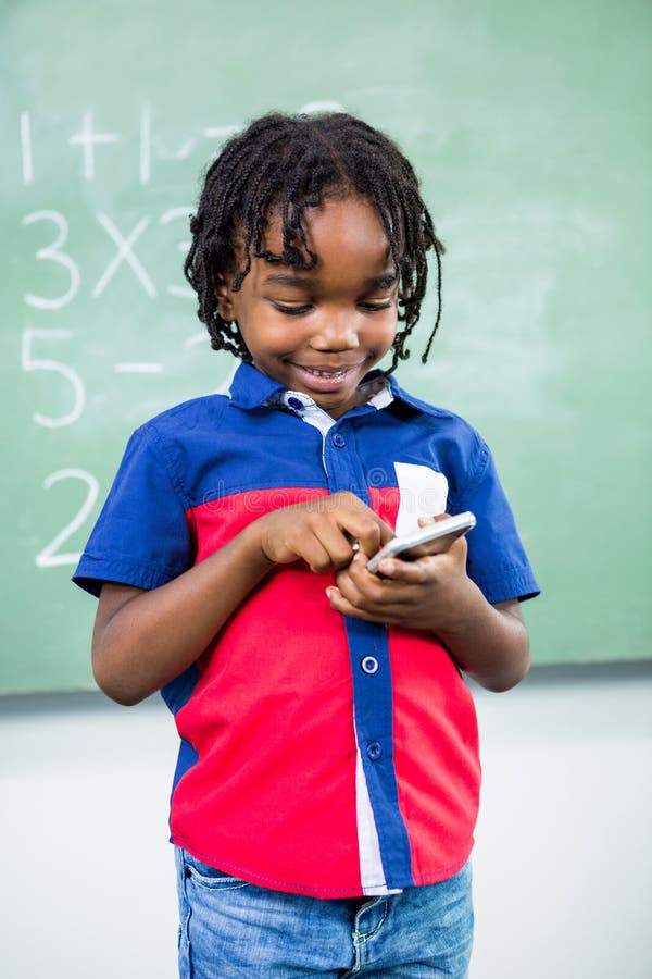 Boy Using Mobile Phone in Classroom Stock Image - Image of casual ...