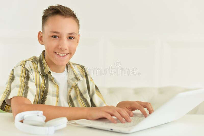 Boy using modern laptop stock image. Image of expression - 119128641