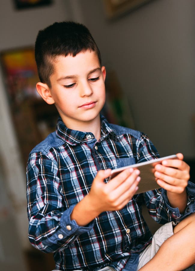 Boy using phone stock image. Image of person, childhood - 117934685