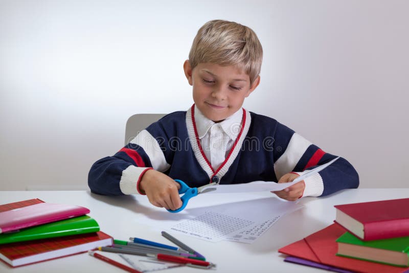 Boy Using Scissors on the Desk Stock Image - Image of desk, exam: 44089955
