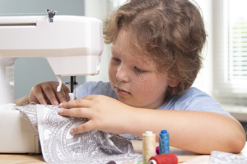 Boy Using Sewing Machine at Home To Make Crafts Stock Image - Image of ...