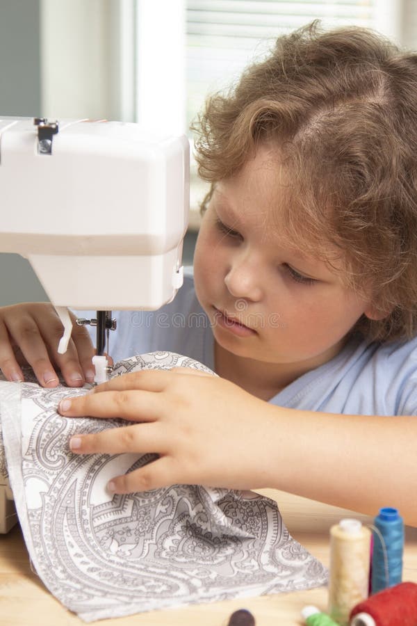 Boy Using Sewing Machine at Home To Make Crafts Stock Photo - Image of ...