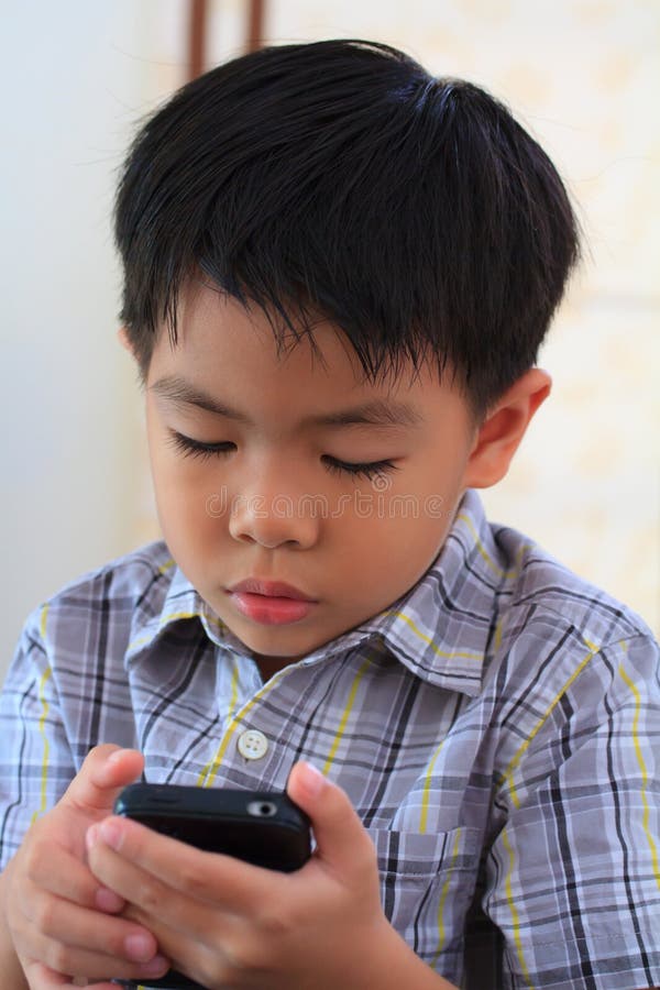 Boy is Using the Smart Phone Stock Image - Image of asian, phone: 32562019