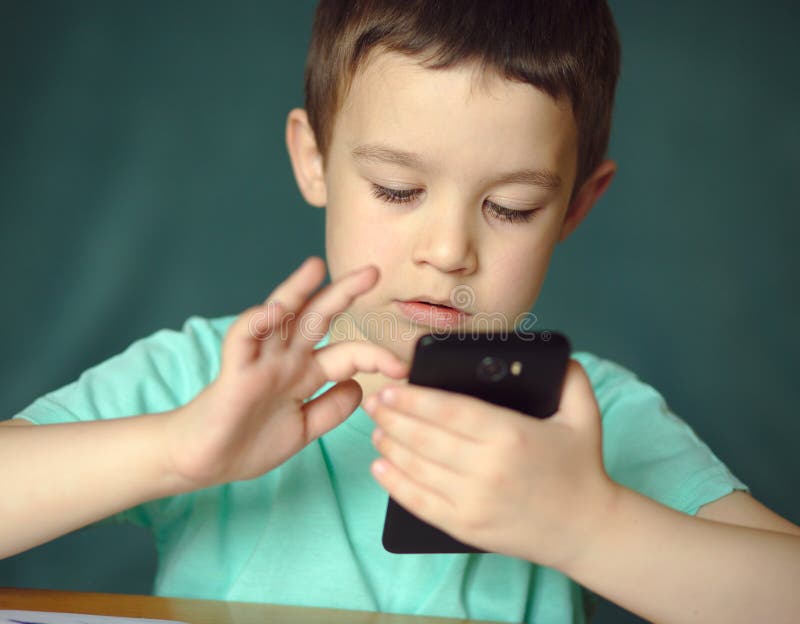 Boy is using smartphone stock photo. Image of caucasian - 93097750