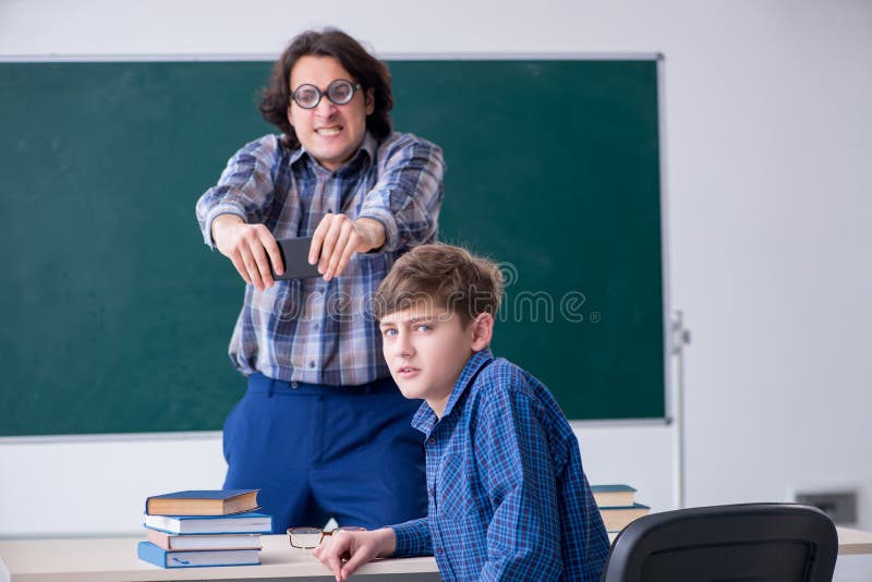 Boy Using Smartphone during the Lesson Stock Photo - Image of ...