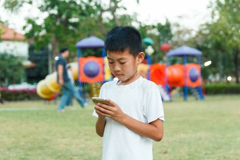 Boy using smartphone. stock image. Image of mobile, cheerful - 96471073