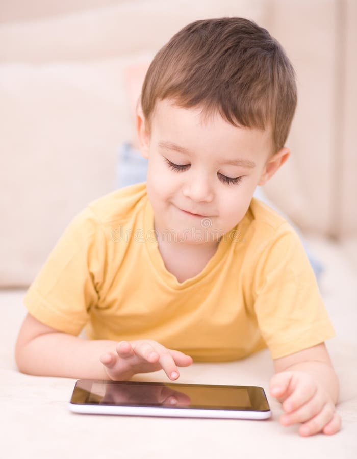 Boy using tablet stock image. Image of news, computer - 36747985