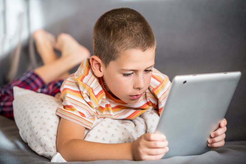 Boy using tablet stock image. Image of portrait, human - 61922815
