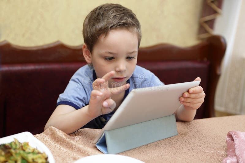 Boy using tablet PC stock image. Image of game, computer - 73803641