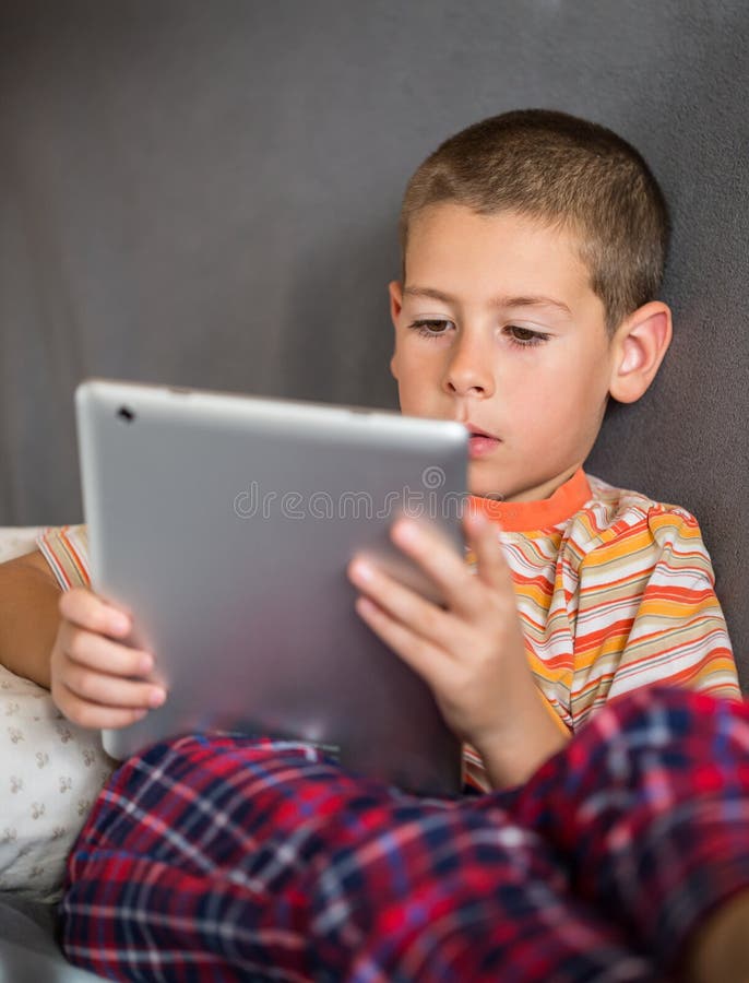 The boy using tablet stock image. Image of learning, internet - 61814145