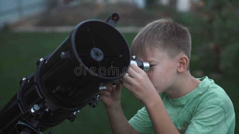 Boy using telescope. stock video. Video of learn, science - 101795859