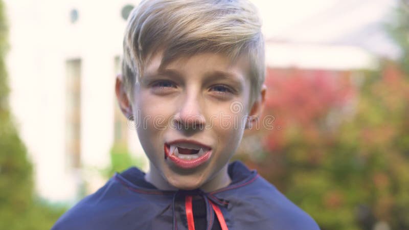 Boy in Vampire Costume Posing for Camera, Makeup As Evil Spirits on ...
