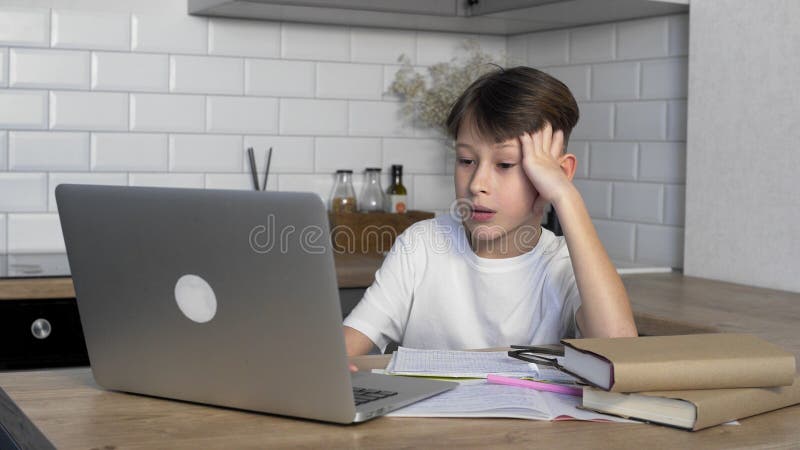 The Boy is Very Tired of Studying. Online Lesson. Study Stock Photo ...