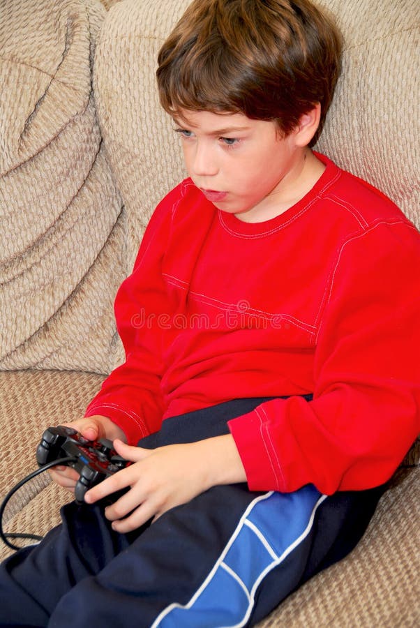 Boy Playing Video Game stock image. Image of mood, scowl - 1007523