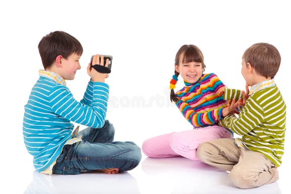 Boy Videotaping Kids Playing Stock Photo - Image of videotaping, hand ...