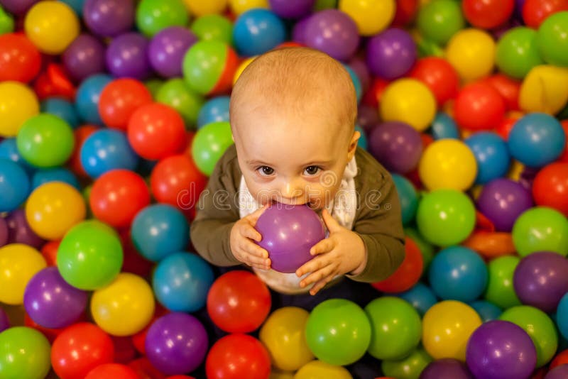 Boy with violet ball stock image. Image of amusement - 46079429
