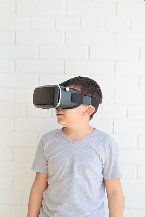 Boy with Virtual Reality Glasses on Brick Wall Background Stock Photo ...