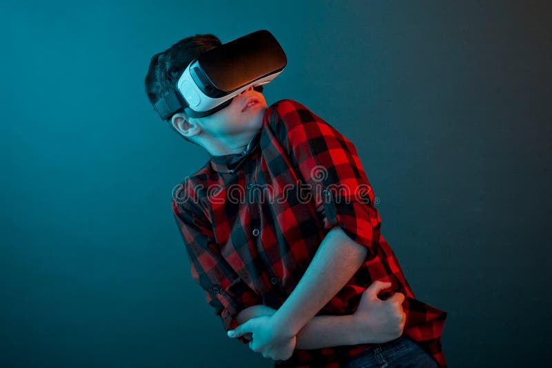 Scared boy in VR headset stock photo. Image of emotion - 95441204