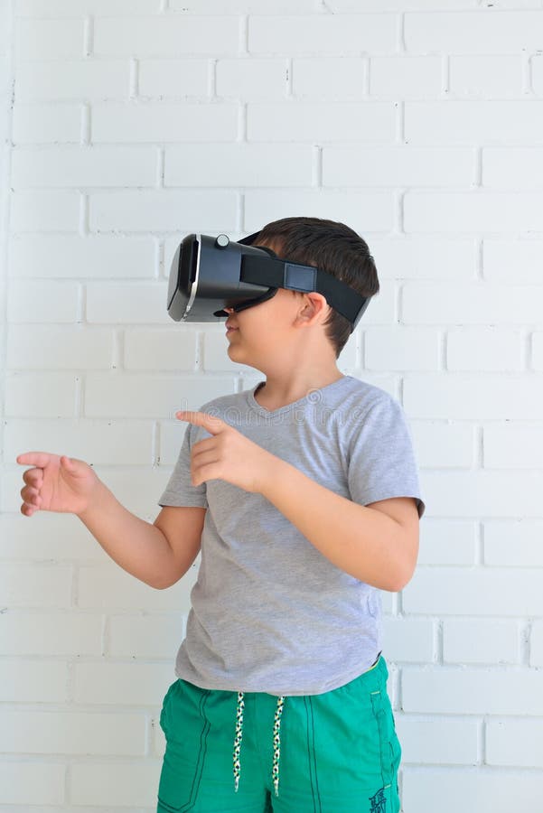 Boy with Virtual Reality Glasses on Brick Wall Background Stock Photo ...