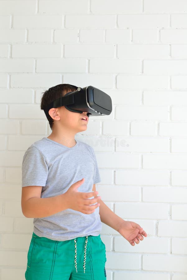 Boy with Virtual Reality Glasses on Brick Wall Background Stock Image ...