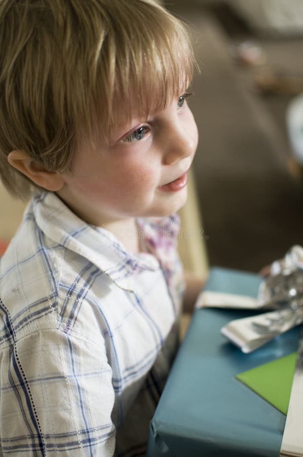 Boy waits with present stock photo. Image of waiting - 27050804