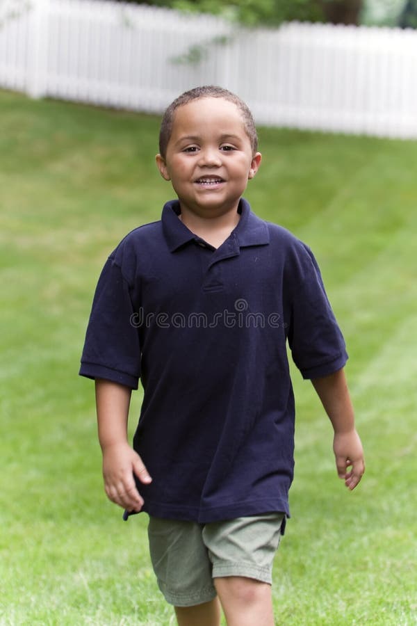 Boy walking stock photo. Image of yard, african, latino - 9725430
