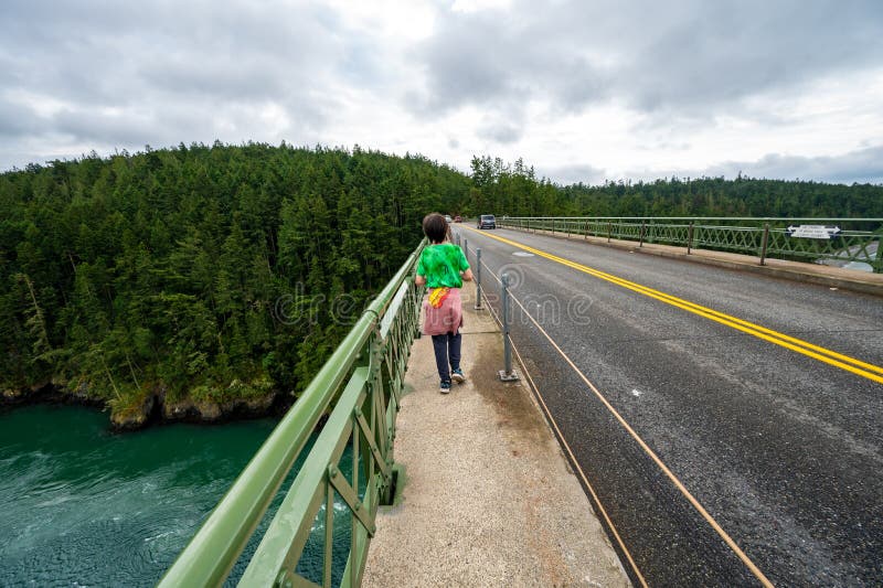 Boy Walking on Deception Pass Bridge Editorial Photo - Image of freeway ...