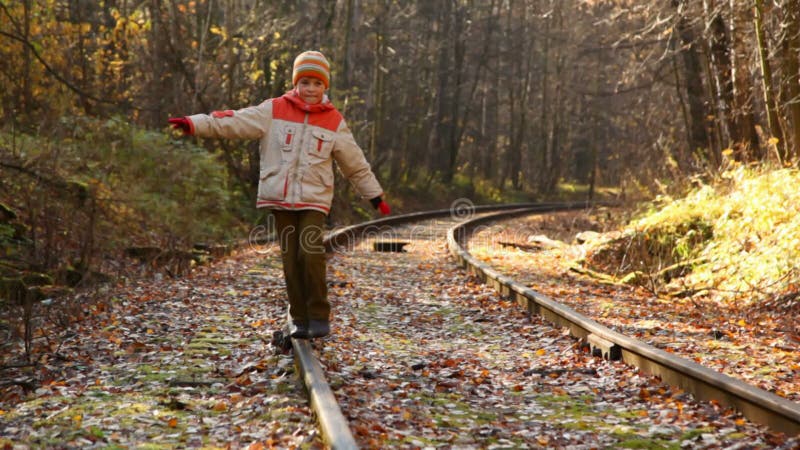 Boy Walking on Rail for Train at Stock Video - Video of perspective ...