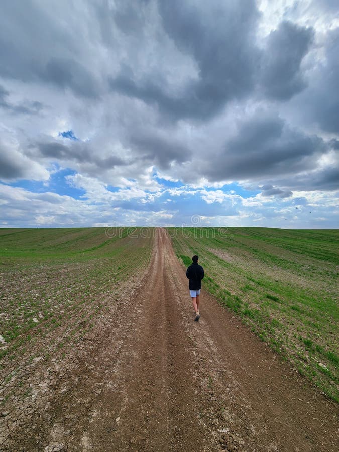 Boy Walking on a Trail in the Fields Stock Photo - Image of mountain ...