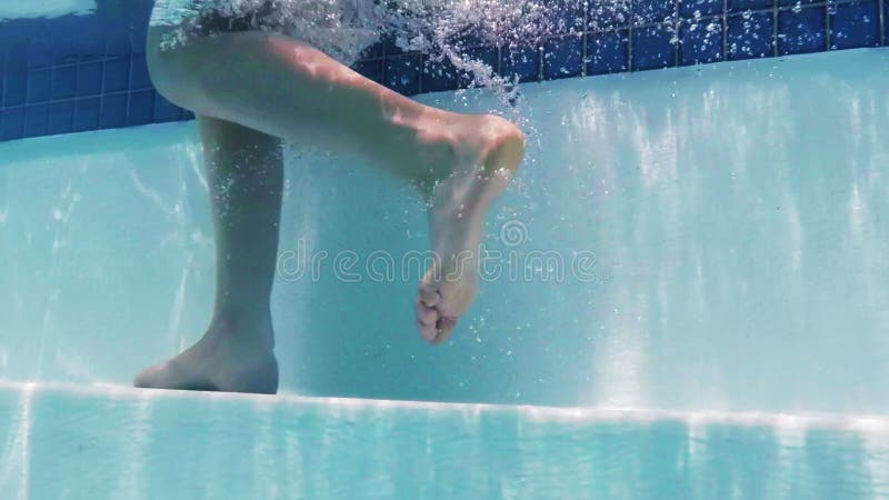 Boy Walking Underwater on Steps in Swimming Pool Stock Footage - Video ...