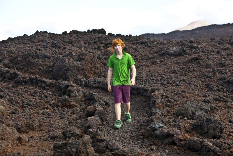 Boy Walking in Volcanic Area Stock Photo - Image of power, canary: 36149062