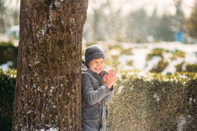 A Boy Warms His Hands from the Cold in Winter Stock Image - Image of ...