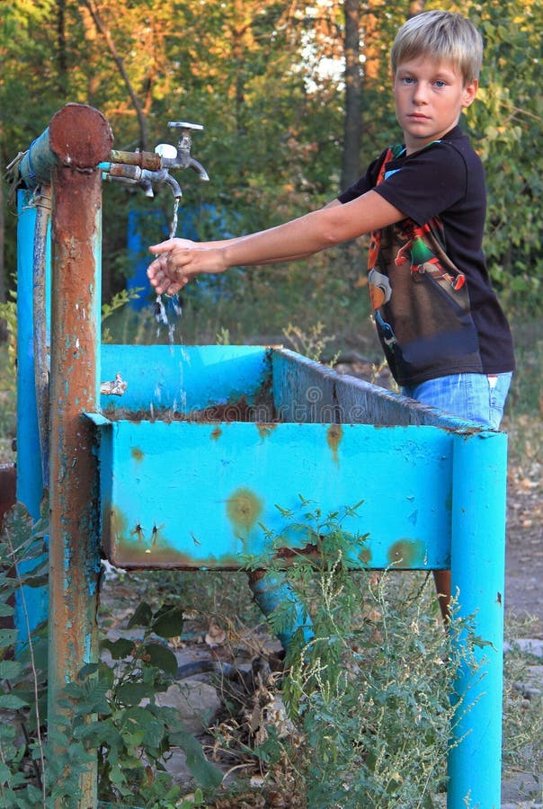 Boy is Washing Hands in Outdoor Wash Basin Stock Photo - Image of hand ...