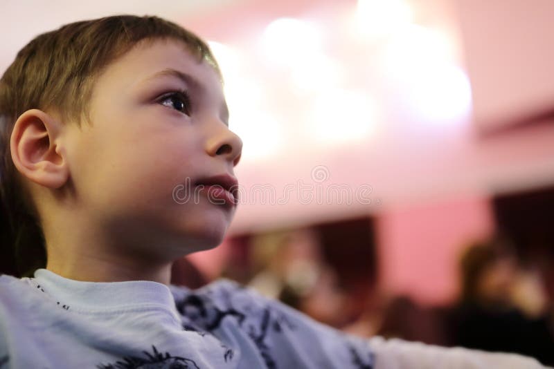 Boy Watching Theatrical Performance Stock Photo - Image of chair ...