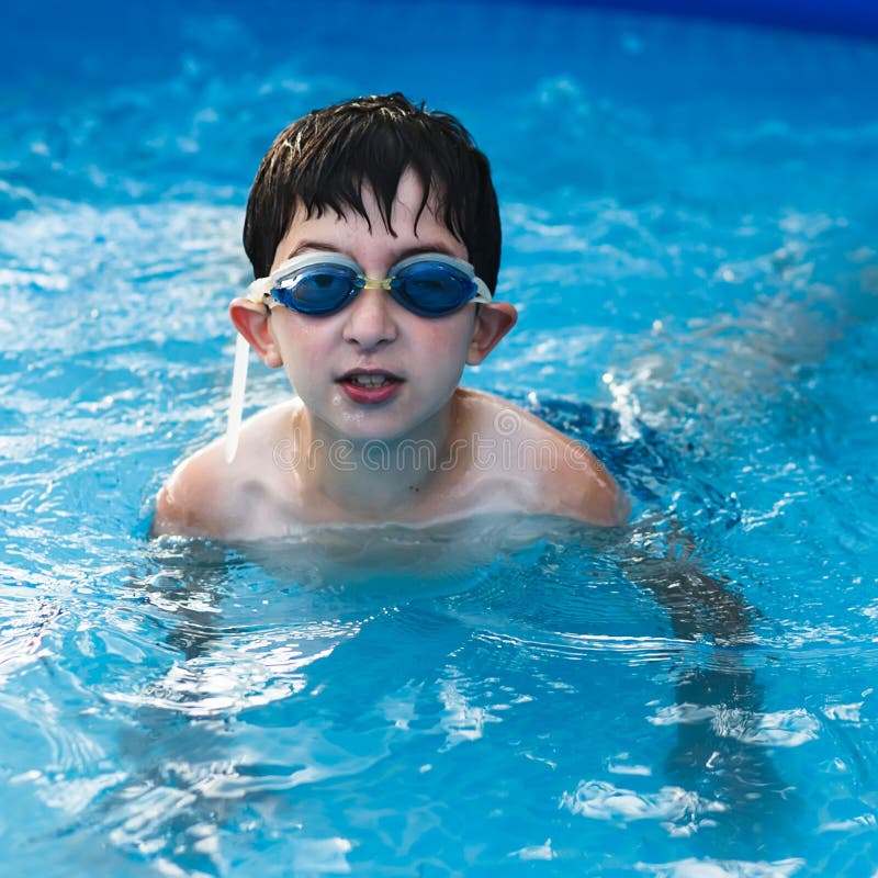 Boy in water with thumbs stock image. Image of childhood - 33194579