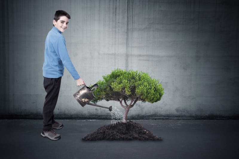 Boy watering the tree stock photo. Image of reforestation - 50146926