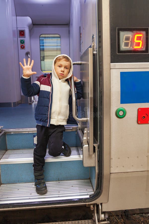 Boy Waves His Hand from the Train Stock Photo - Image of back, hand ...