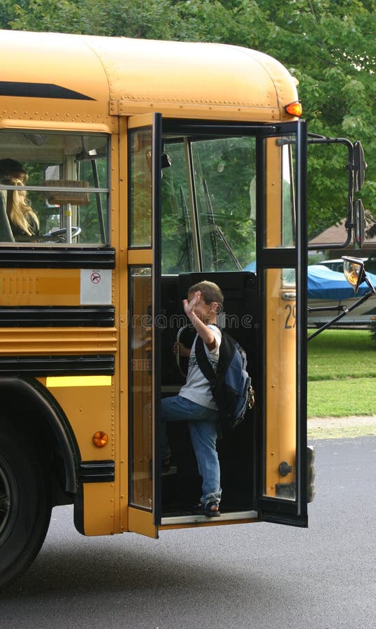 Boy Waving getting on Bus stock image. Image of happiness - 1213207