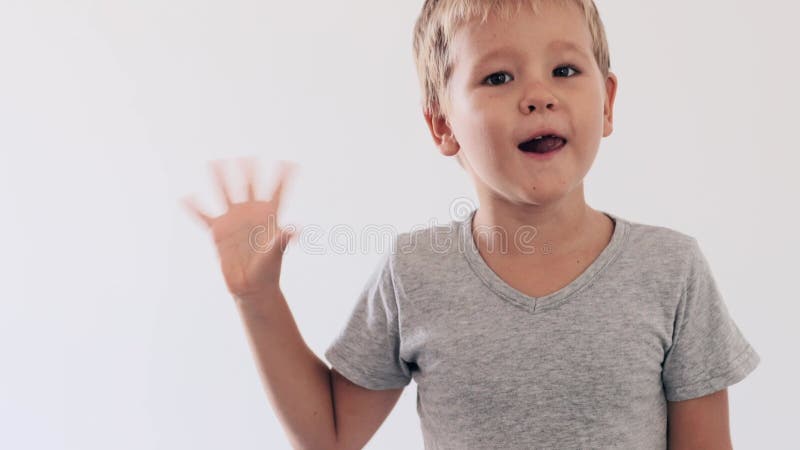 Boy waving by hand stock video. Video of smile, little - 193853541